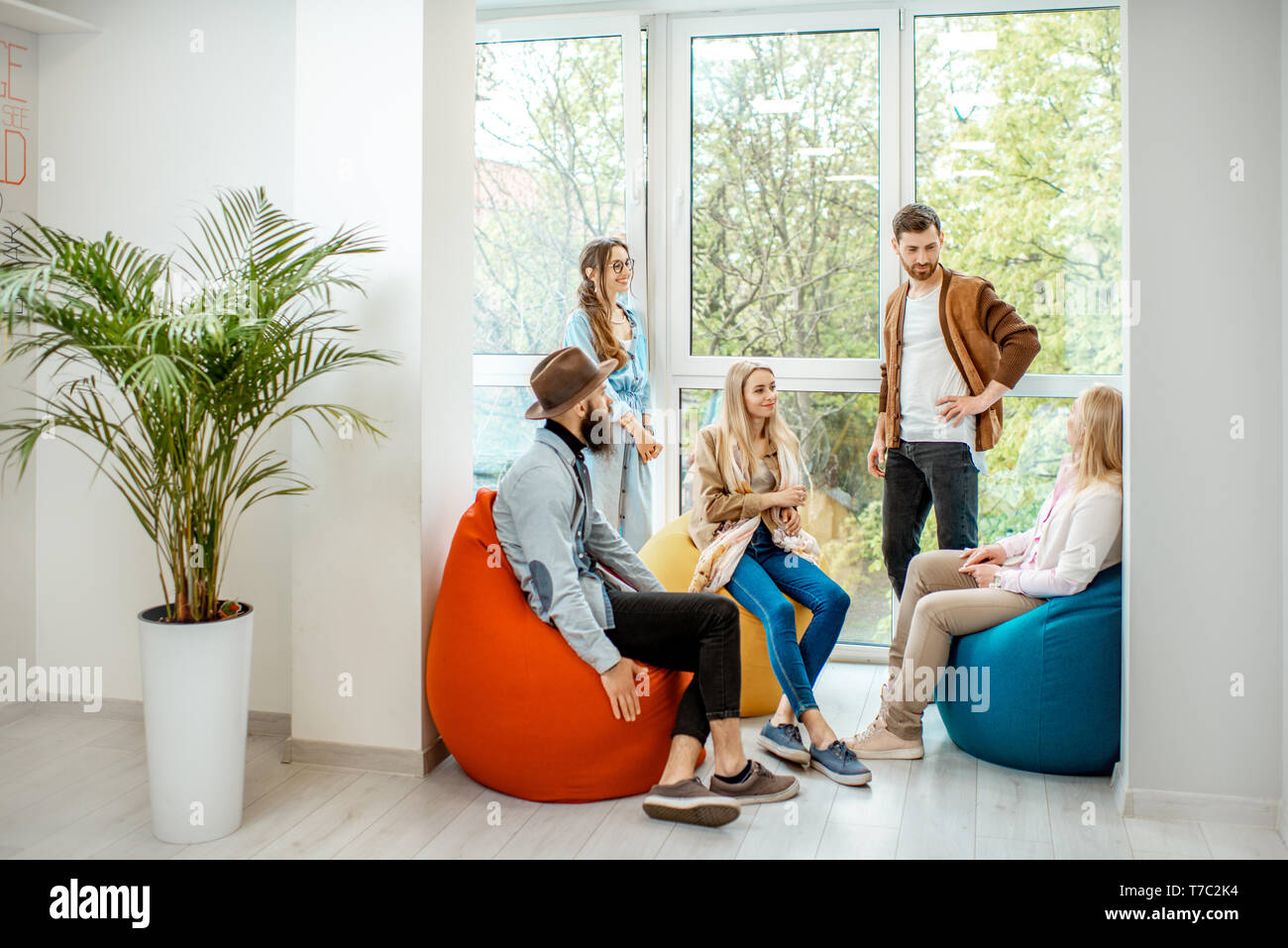Group of diverse people having a conversation during the coffee break ...