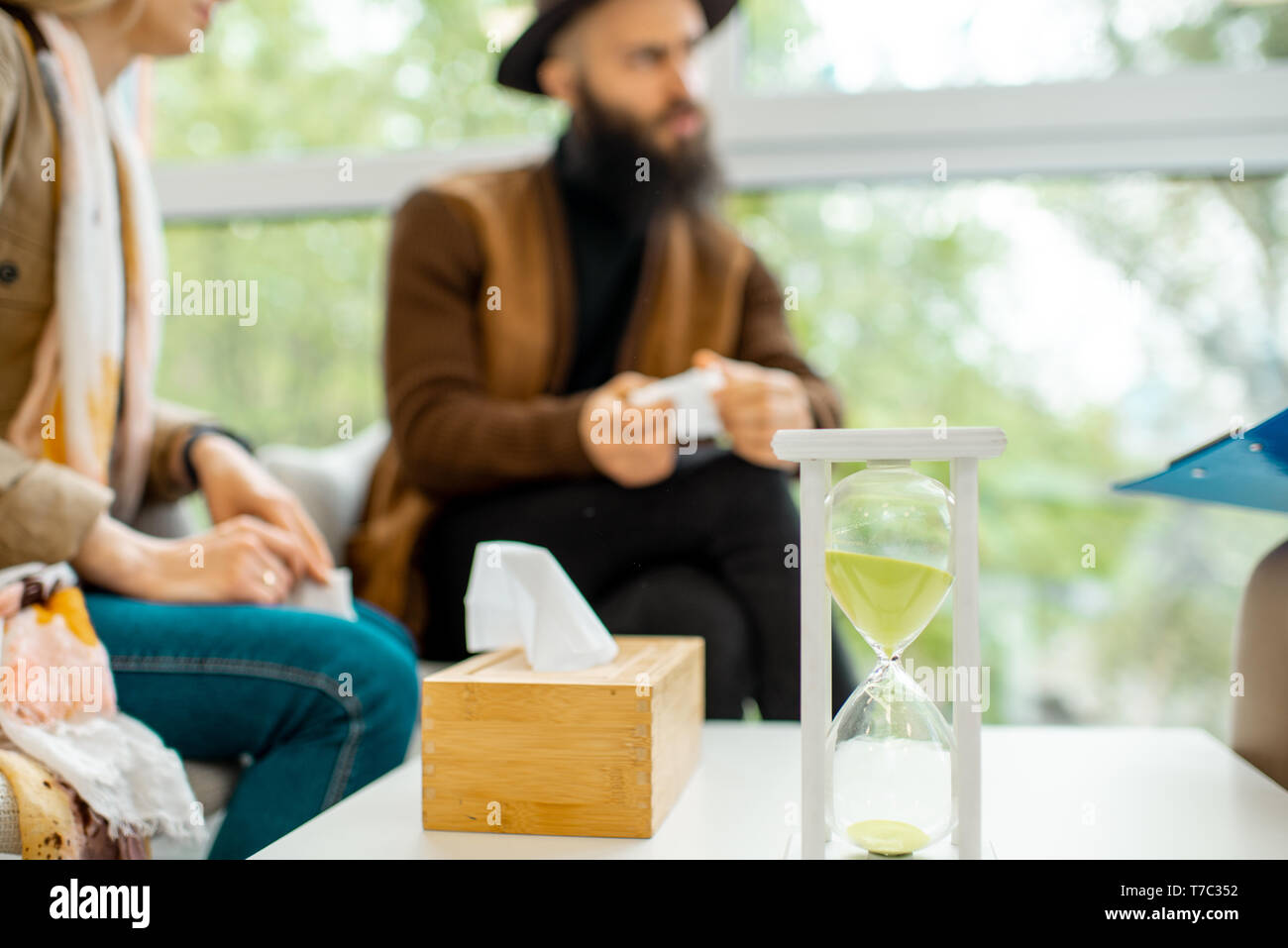 Couple sitting with psychologist during the mental therapy, cropped ...