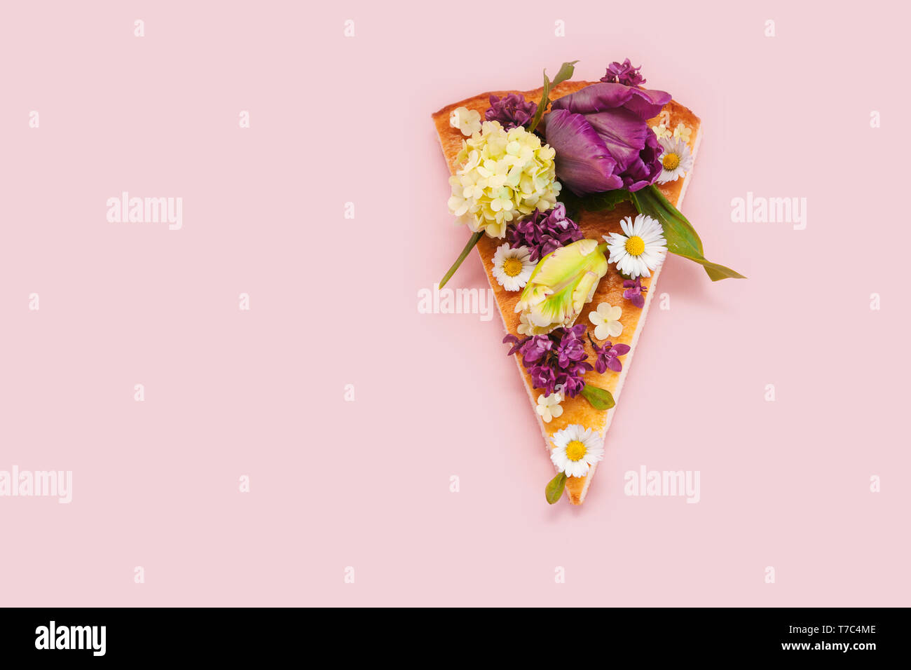 Slice of pizza on a pink background with spring flowers. Piece of pizza ...