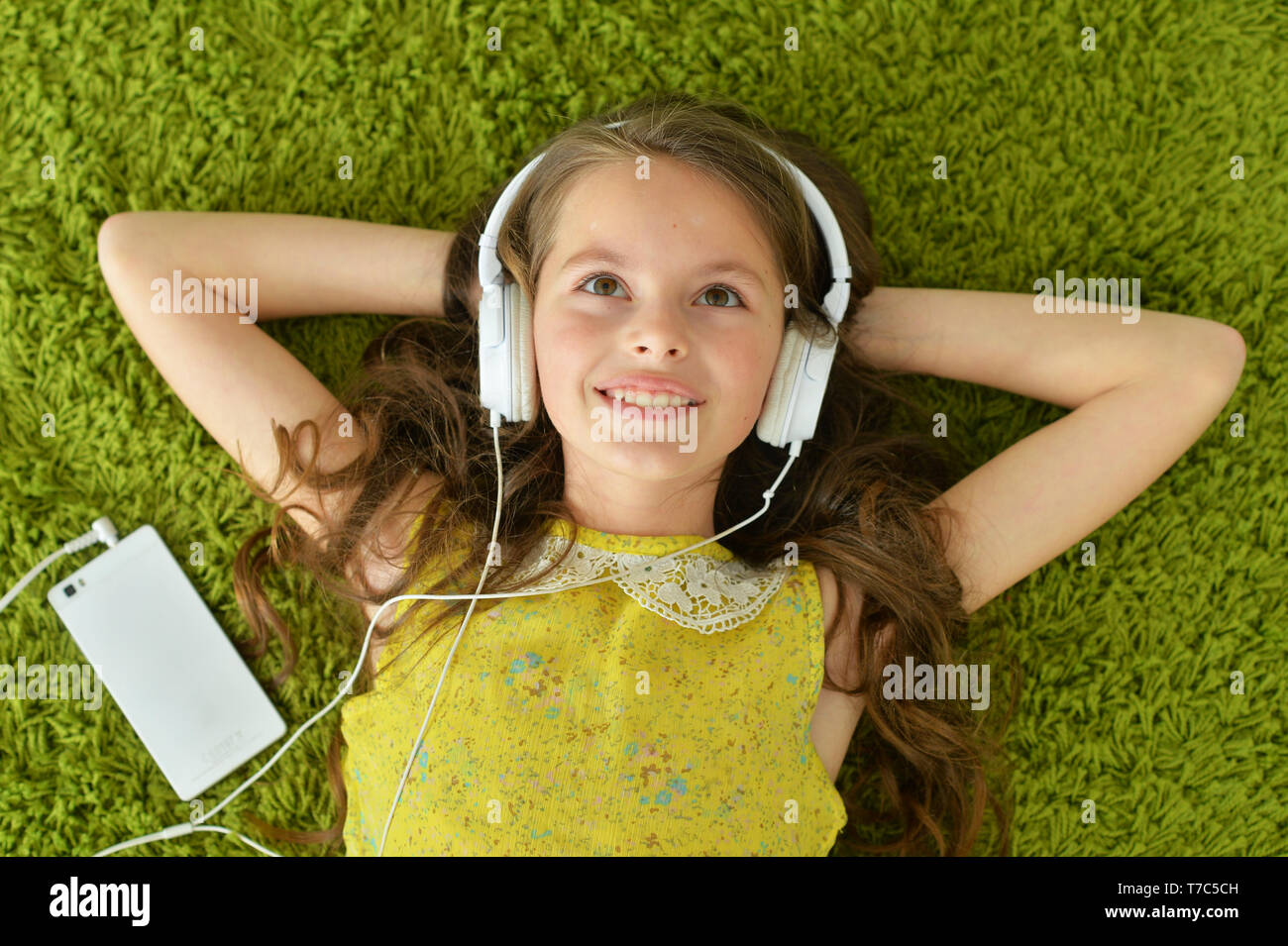 Portrait of cute little girl with headphones Stock Photo - Alamy
