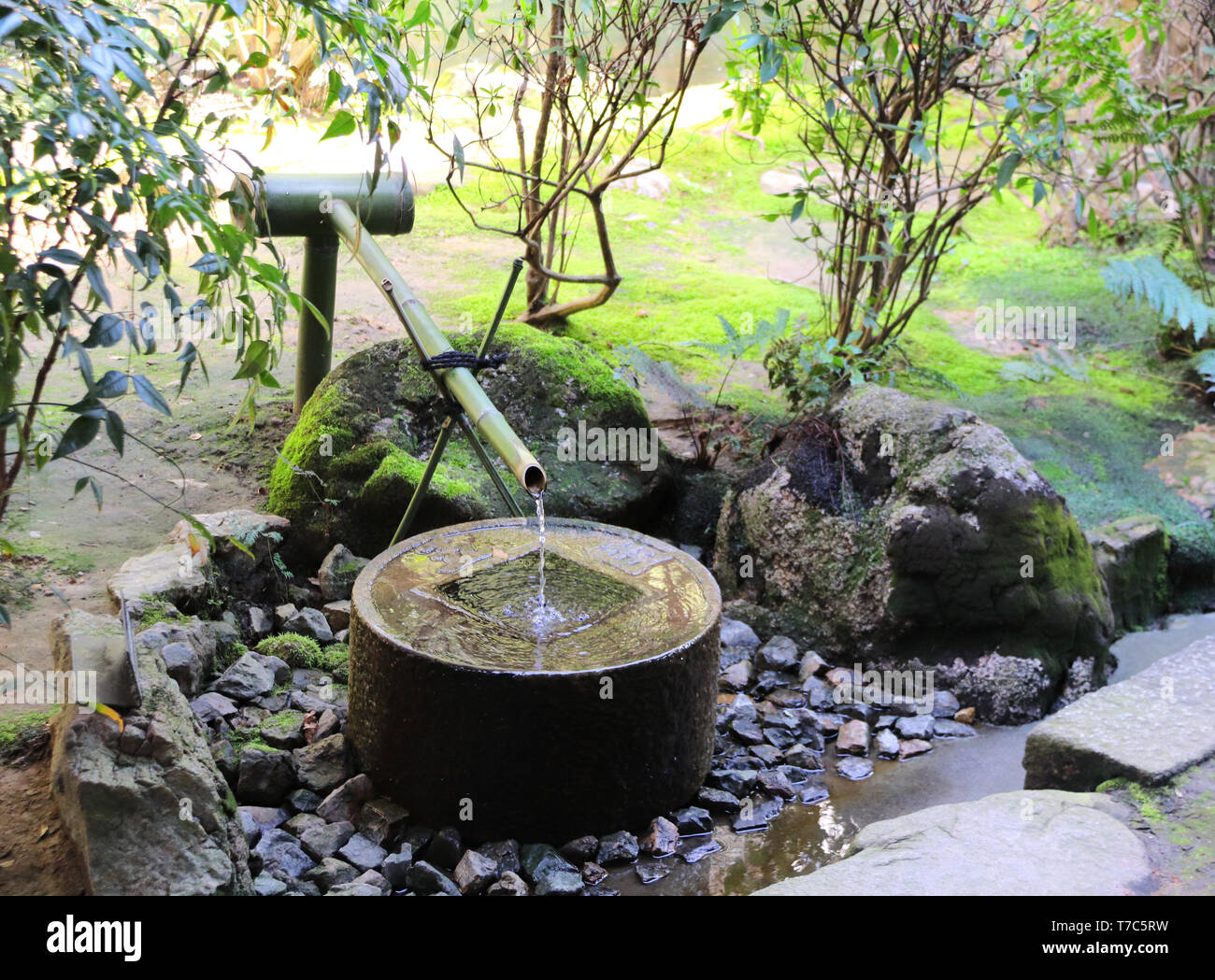 A unique ancient wash-basin of stone Tsukubai in Ryoanji Temple, Kyoto ...