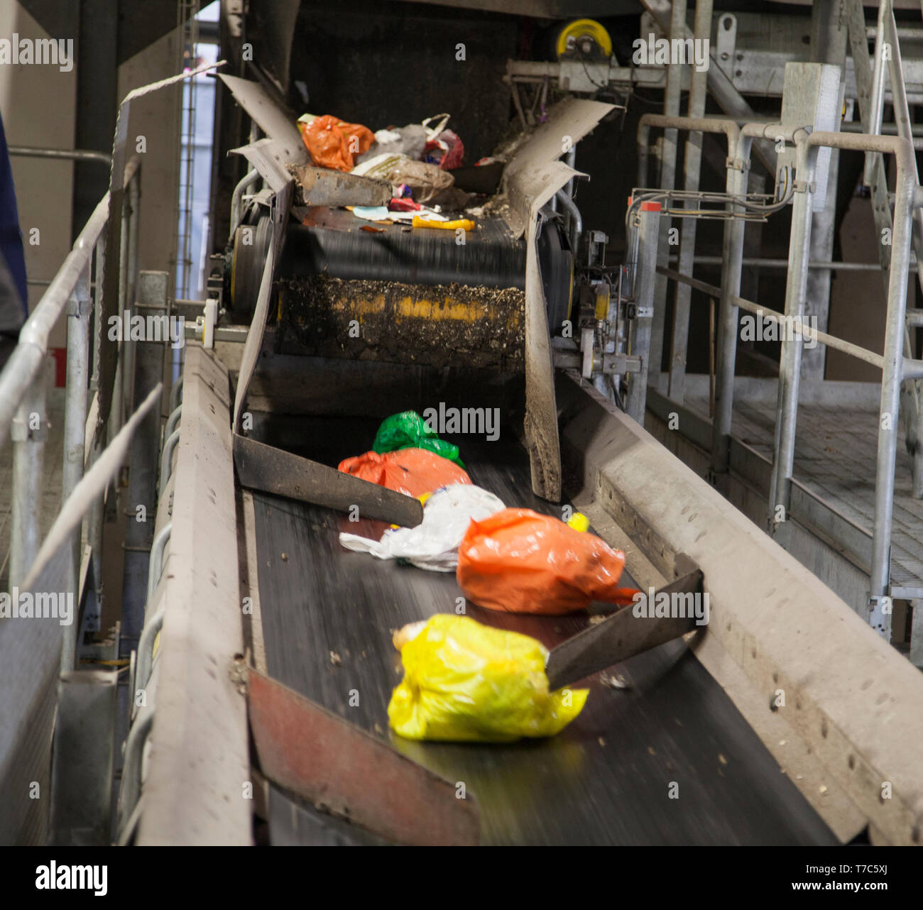 WASTE SEPARATION with different colored plastic bags Stock Photo - Alamy