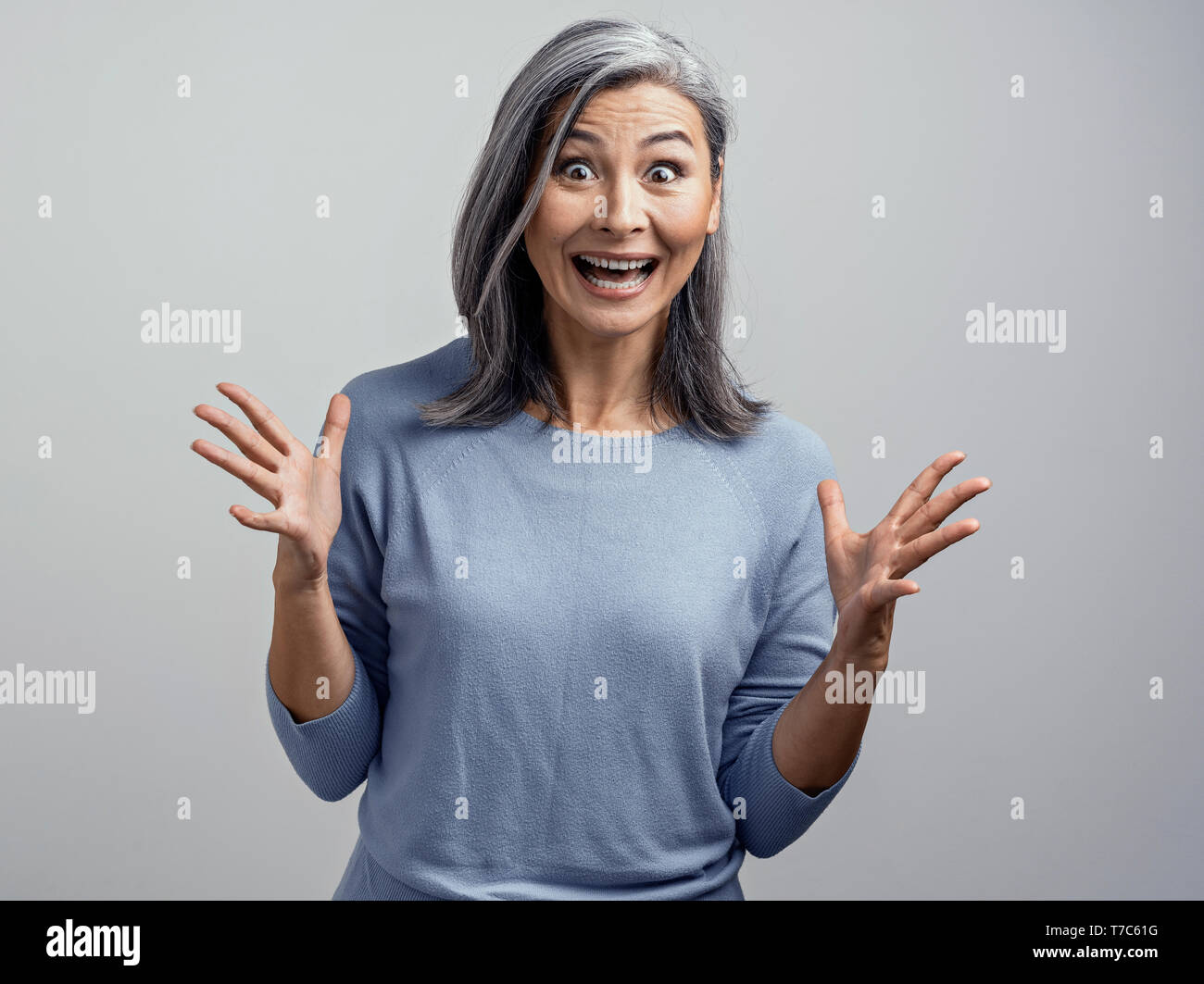 Beautiful Middle-Aged Asian Woman Shows Emotions of Excitement and ...