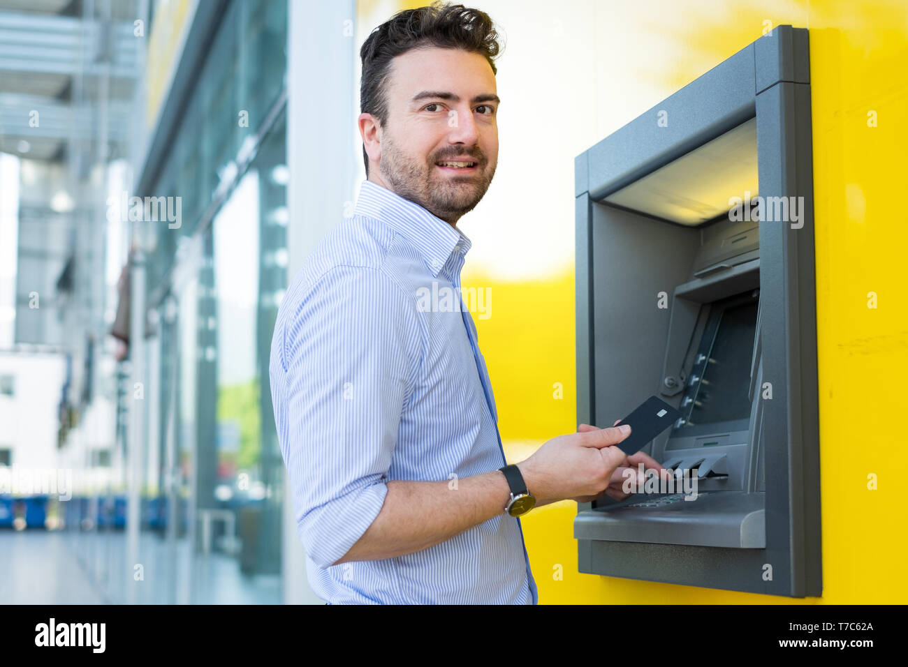 Male withdrawing cash at atm hi-res stock photography and images - Alamy