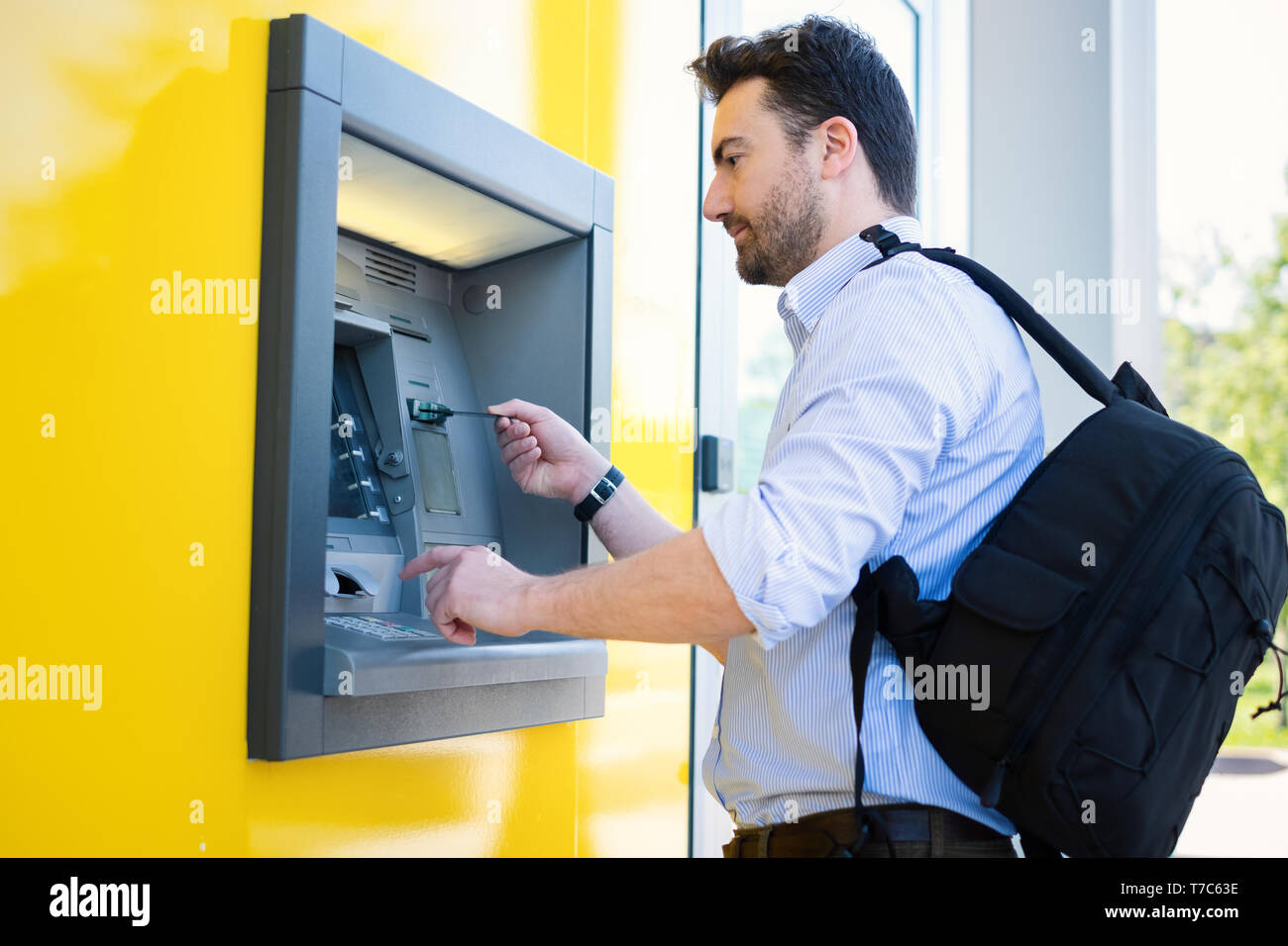 Male withdrawing cash at atm hi-res stock photography and images - Alamy