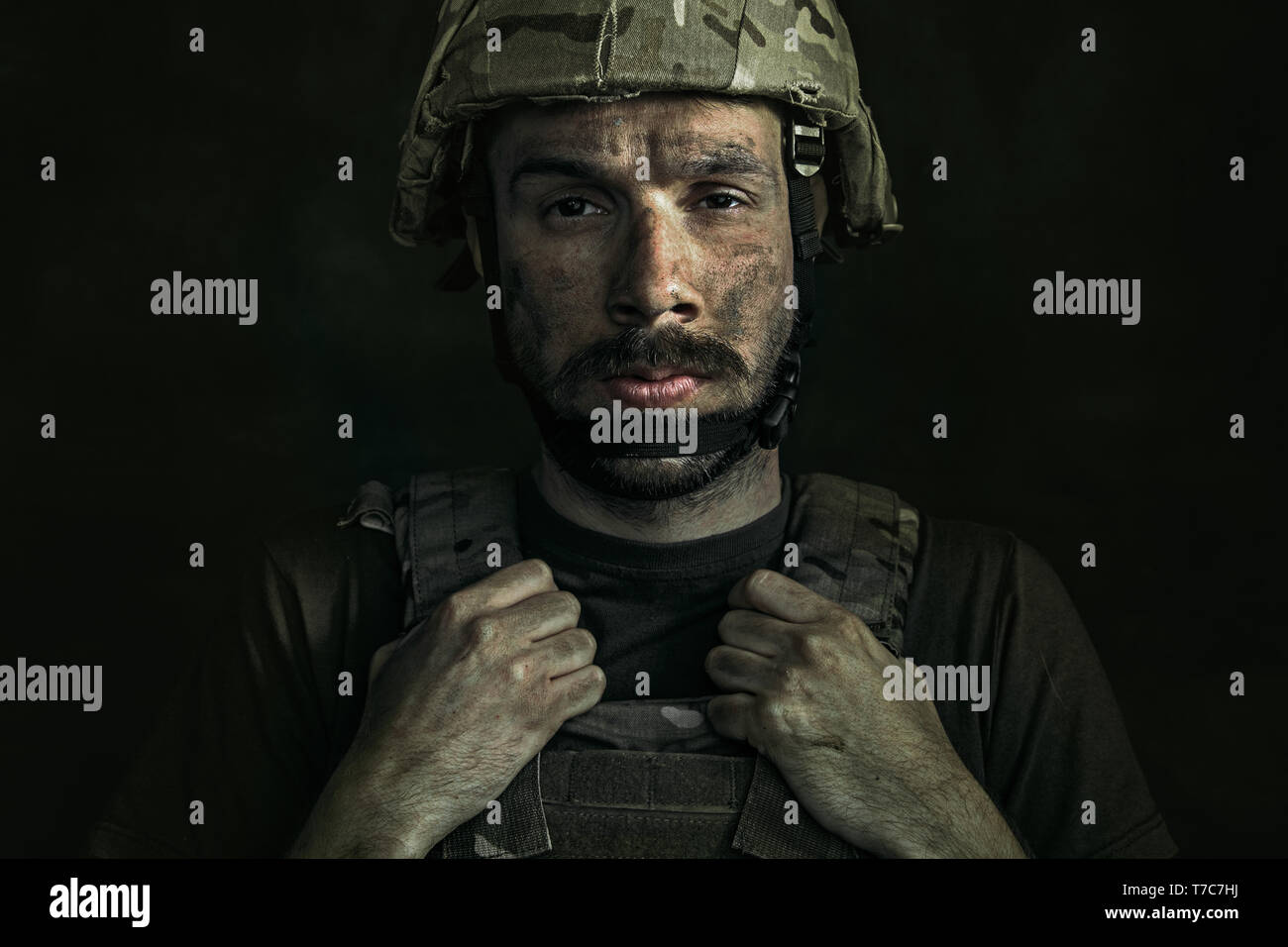 Bleeding injury inside. Close up portrait of young male soldier. Man in ...