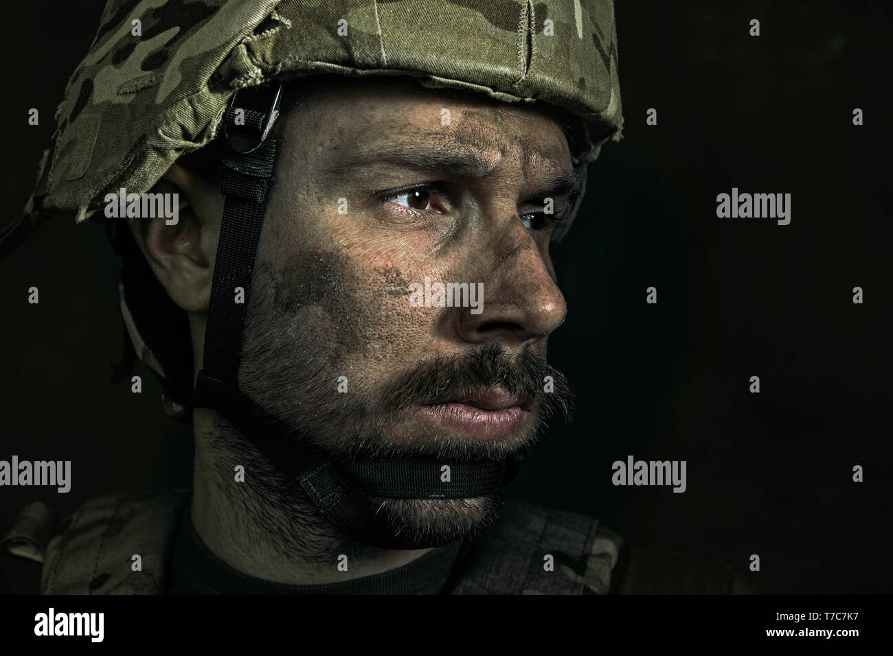 Looking in devil's eyes. Close up portrait of young male soldier. Man ...