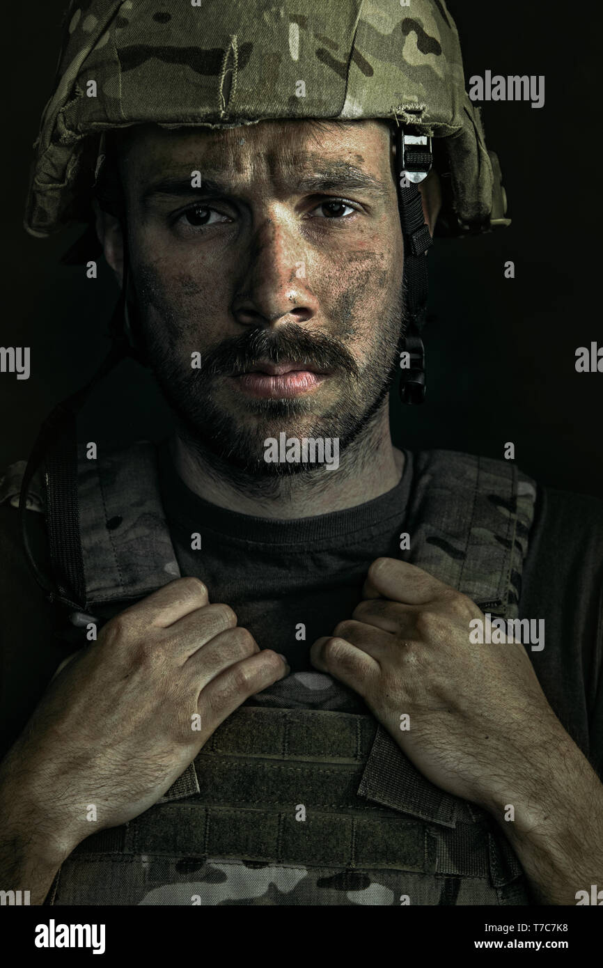 Only one chance to be alive. Close up portrait of young male soldier ...