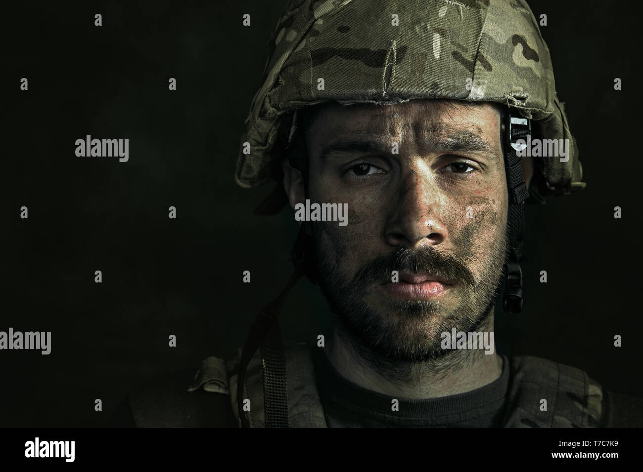 No feels and emotions. Close up portrait of young male soldier. Man in ...