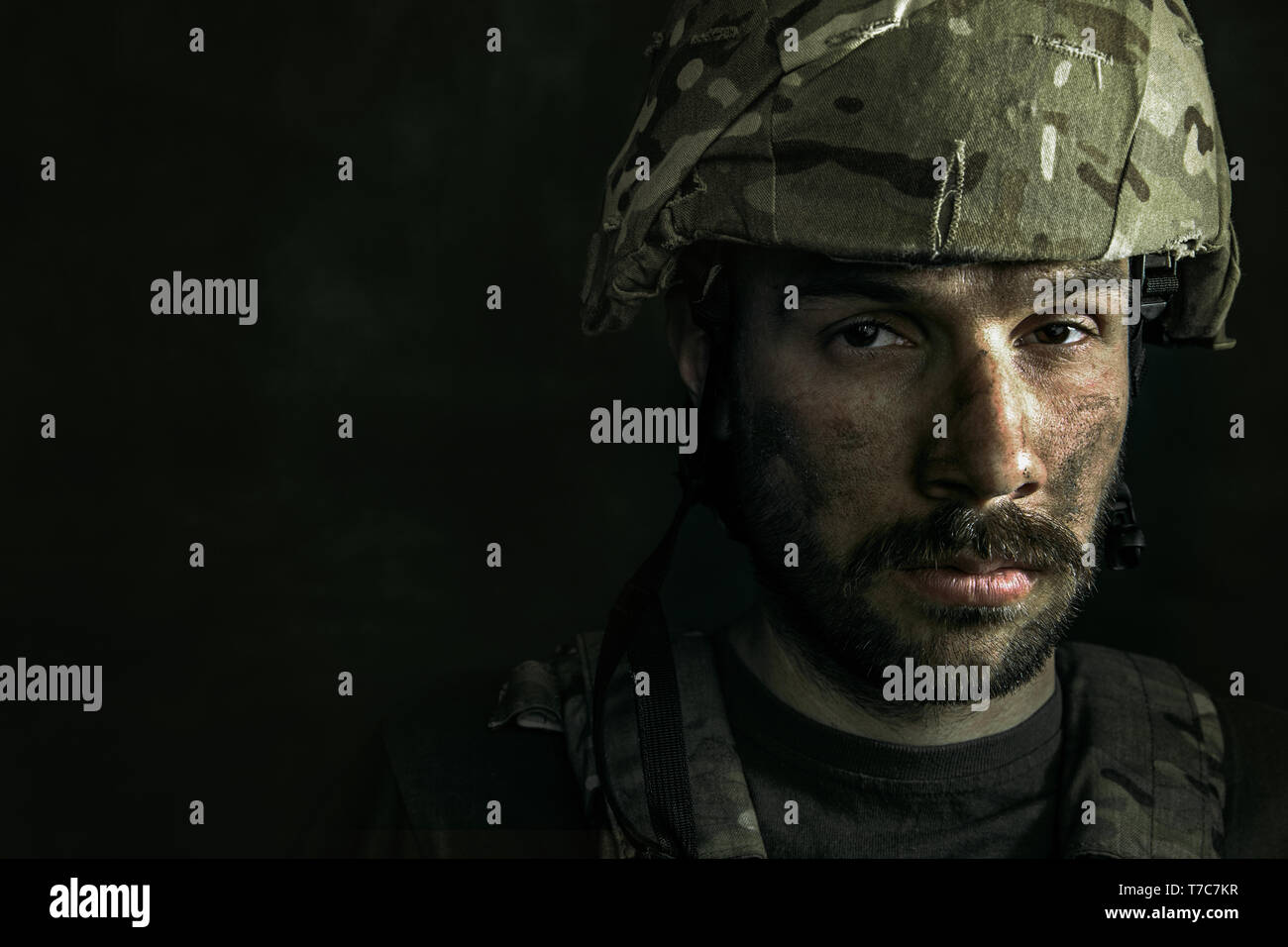 Doesn't wait for real life. Close up portrait of young male soldier ...