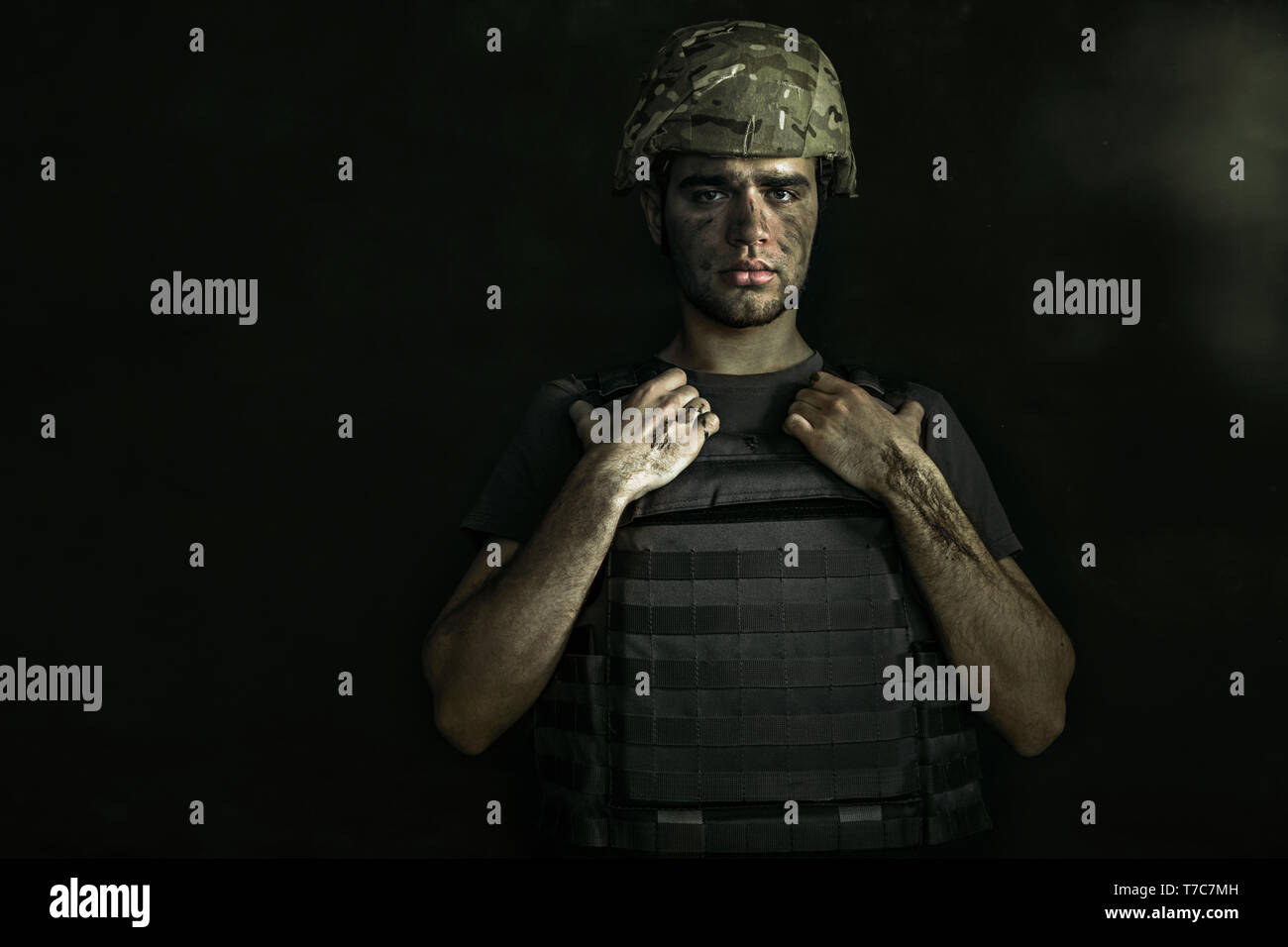Giving a promise to mum. Half-lenght portrait of young male soldier ...