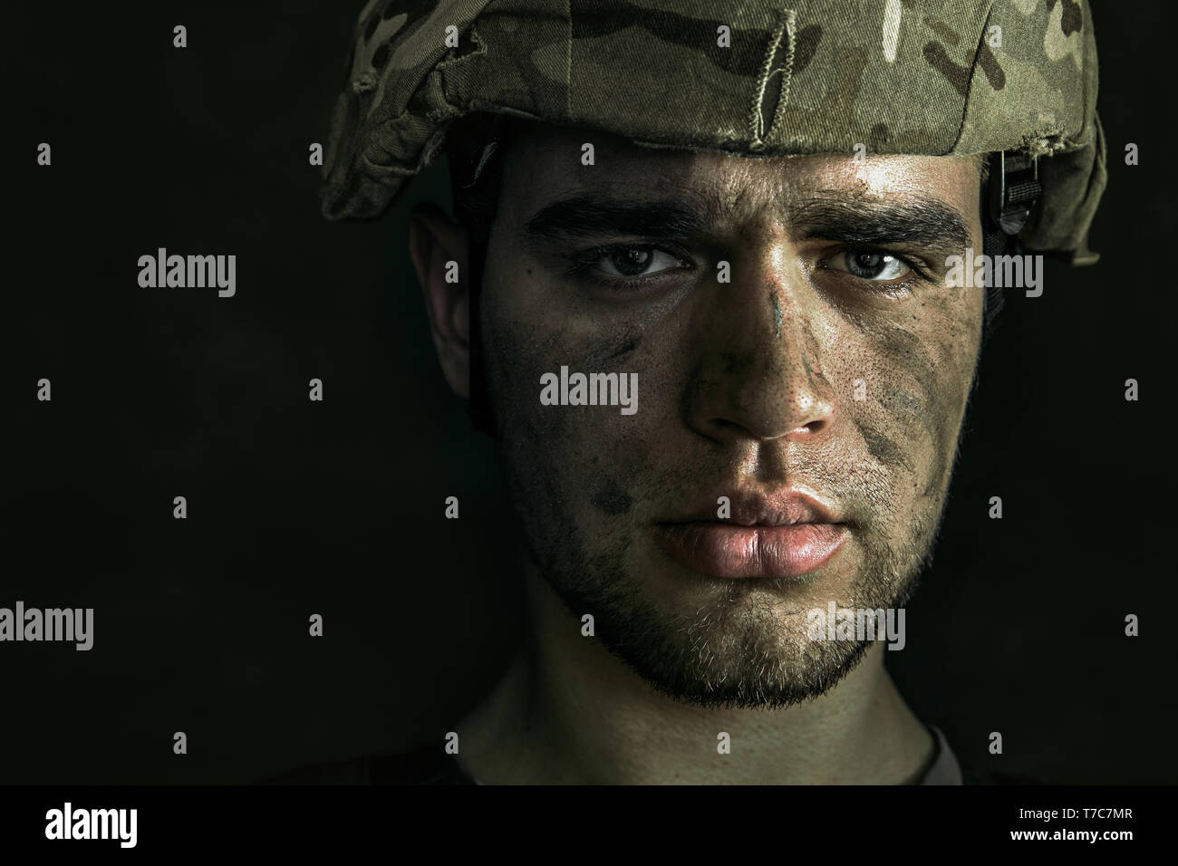 Confusing in himself. Close up portrait of young male soldier. Man in ...