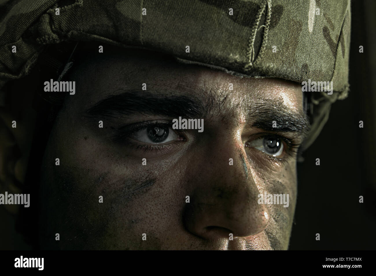What have I do with my life. Close up portrait of young male soldier ...