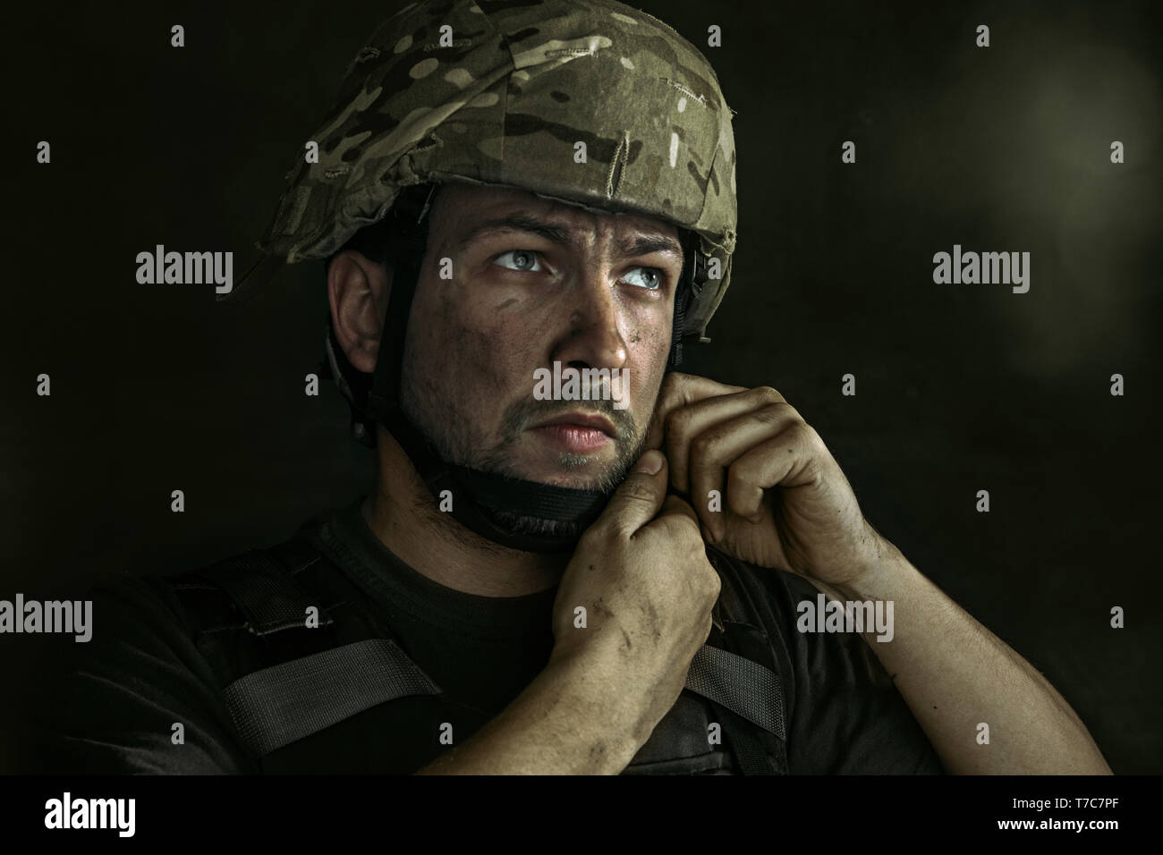 Protect in any ways. Close up portrait of young male soldier. Man in ...