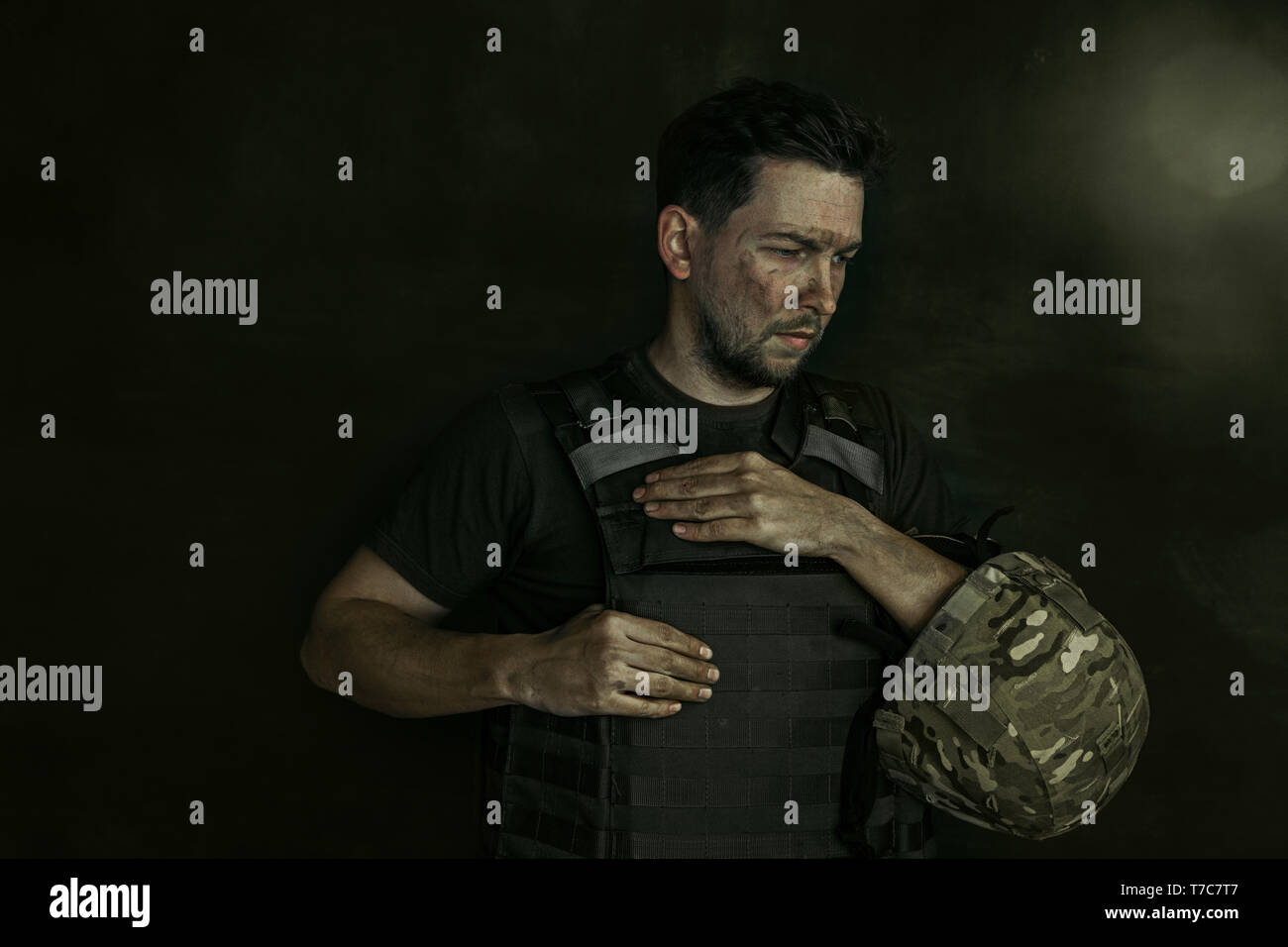 Have no heart, but it hurts. Close up portrait of young male soldier ...
