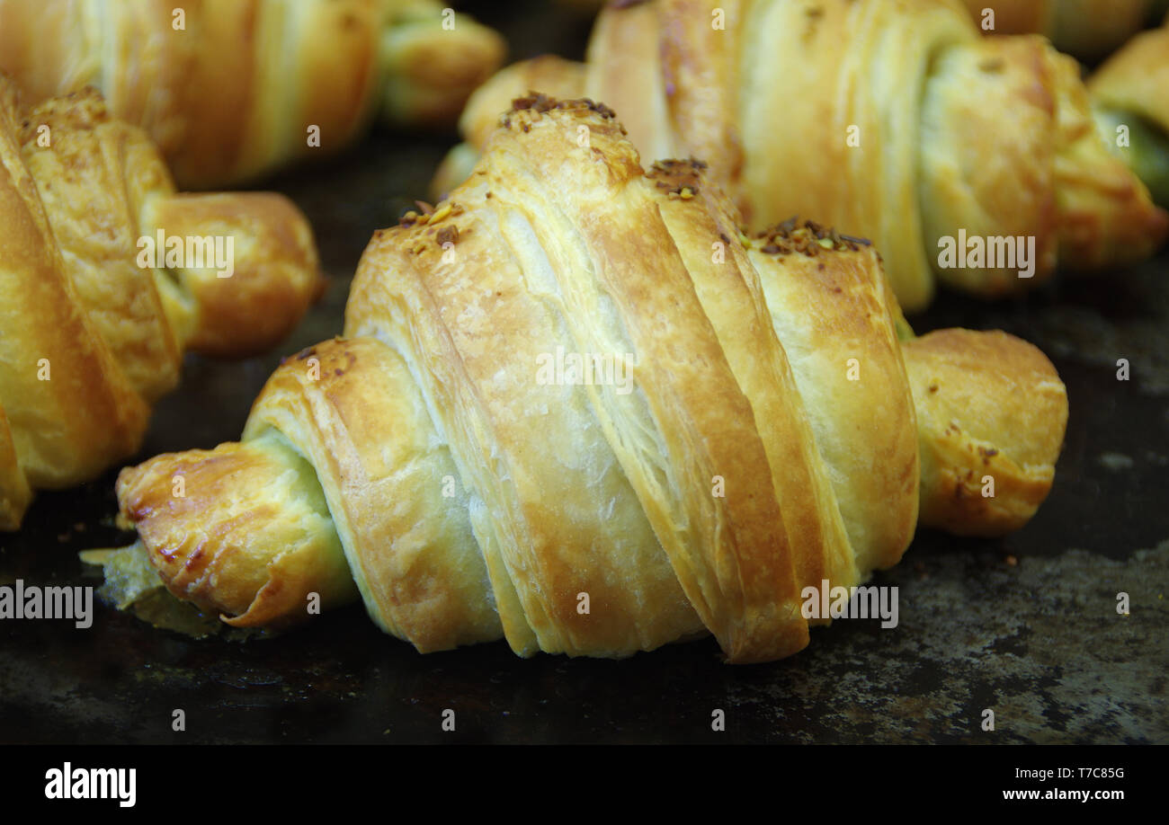 Hot croissant straight from the oven. Fresh french pastry Stock Photo ...