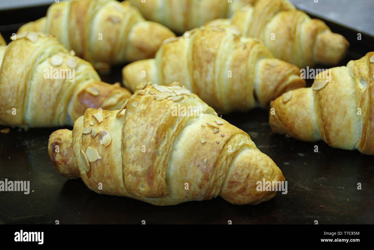 Hot croissant straight from the oven. Fresh french pastry Stock Photo ...