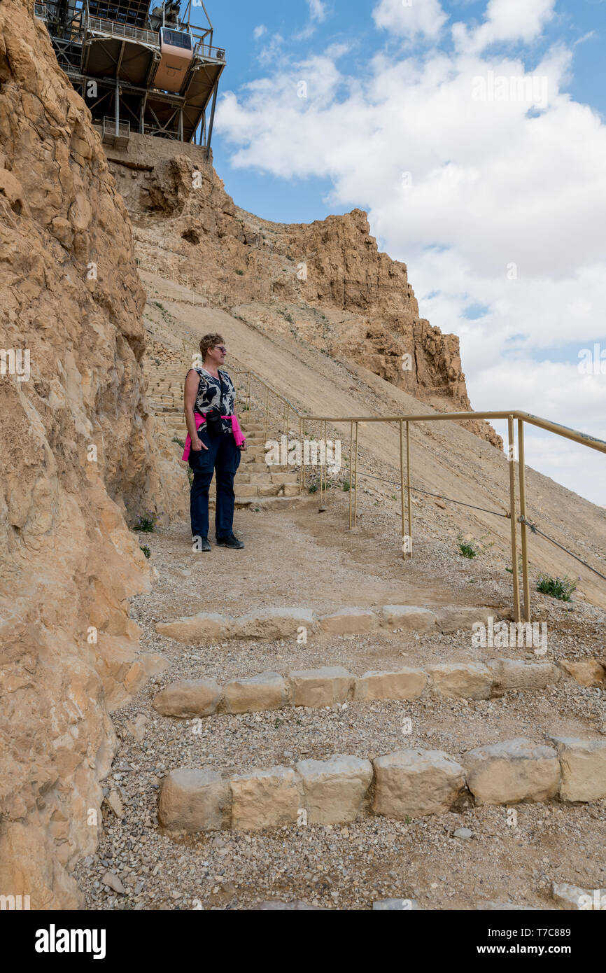woman walking down the 800 steps of the masada mountain in israel Stock ...