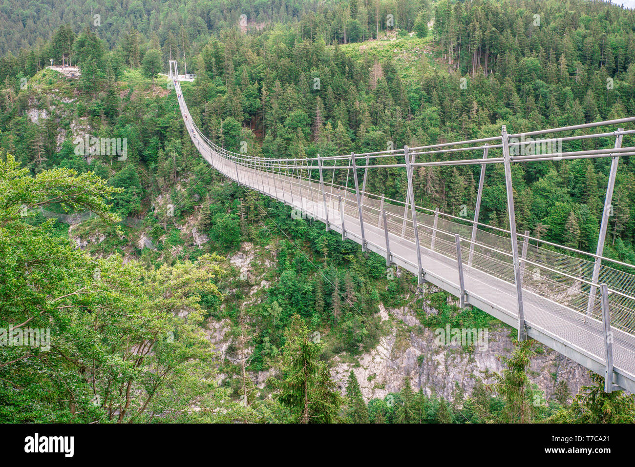 Suspension Bridge at Reutte between two hills in beautiful landscape ...