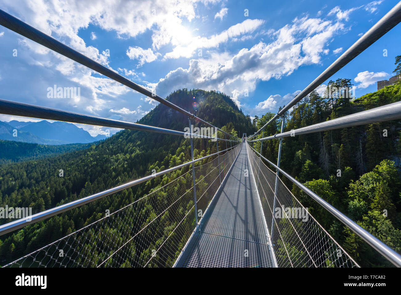 Suspension Bridge at Reutte between two hills in beautiful landscape ...