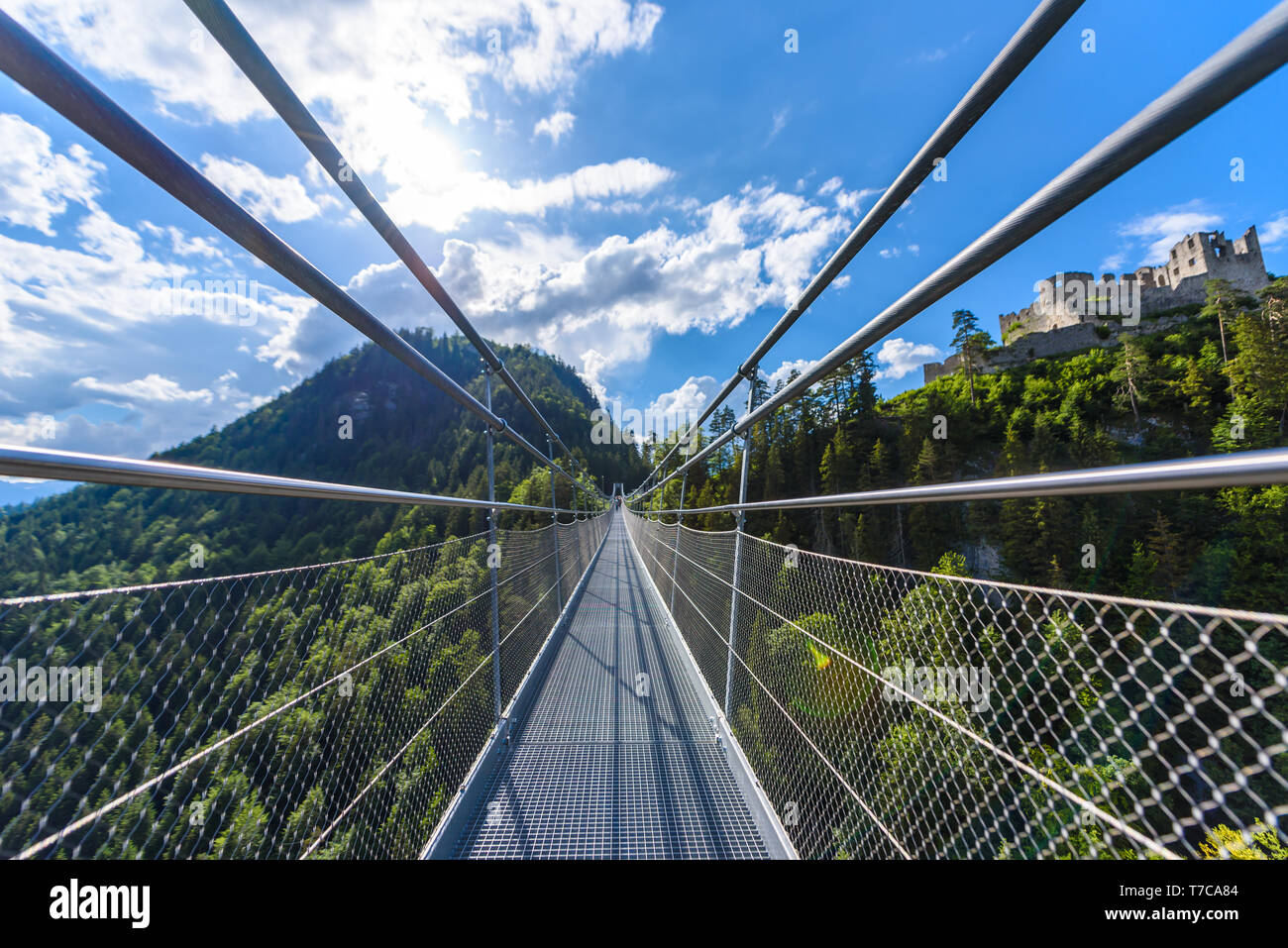 Suspension Bridge at Reutte between two hills in beautiful landscape ...