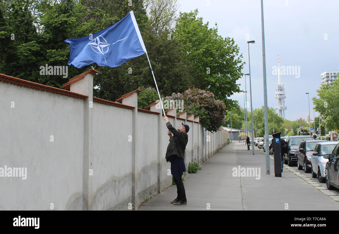 Man holds flag of NATO and protests about 200 members of Night Wolves ...