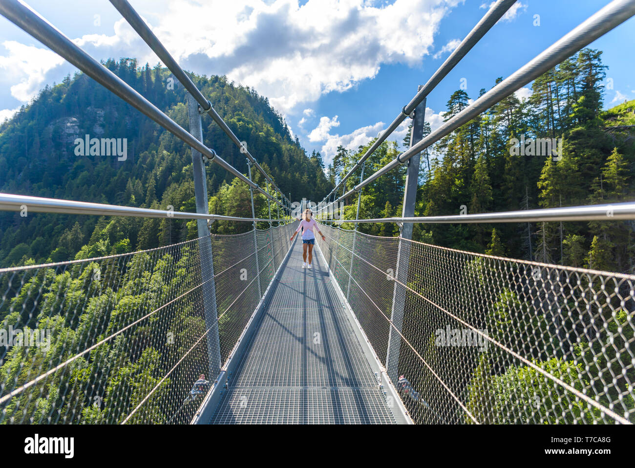 Suspension Bridge at Reutte between two hills in beautiful landscape ...