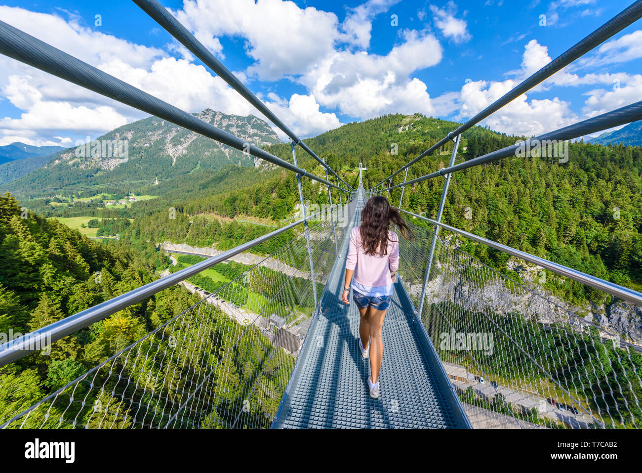 Suspension Bridge at Reutte between two hills in beautiful landscape ...