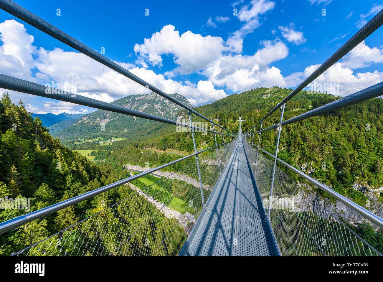Suspension Bridge at Reutte between two hills in beautiful landscape ...