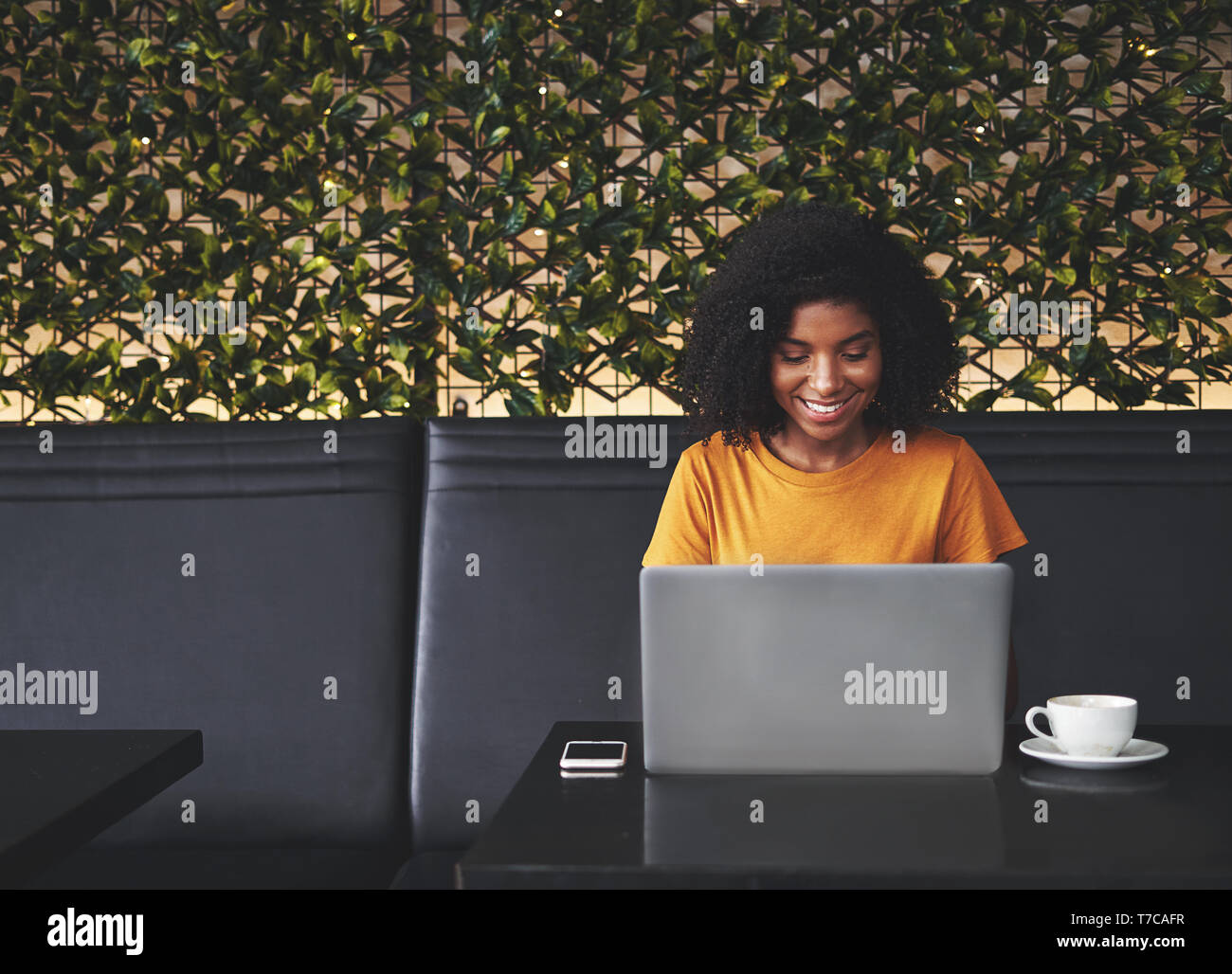 Attractive young lady using hi-res stock photography and images - Alamy