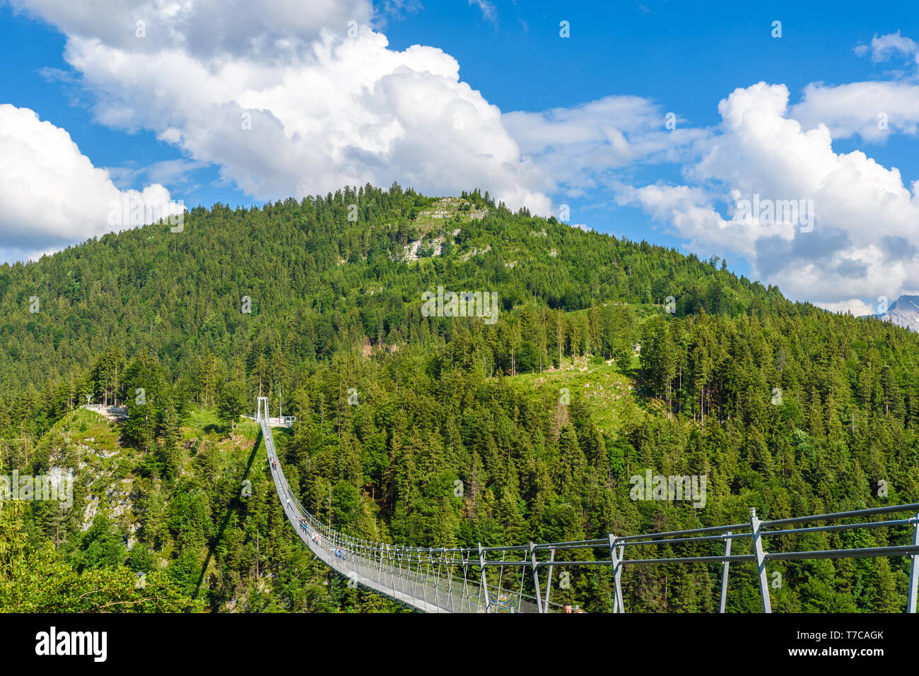 Suspension Bridge at Reutte between two hills in beautiful landscape ...