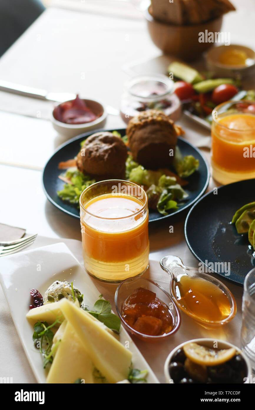 Delicious food served on various plates on a table Stock Photo - Alamy