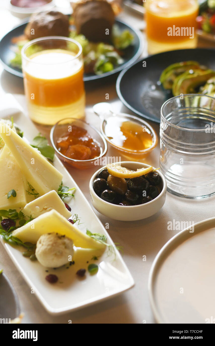 Delicious food served on various plates on a table Stock Photo - Alamy