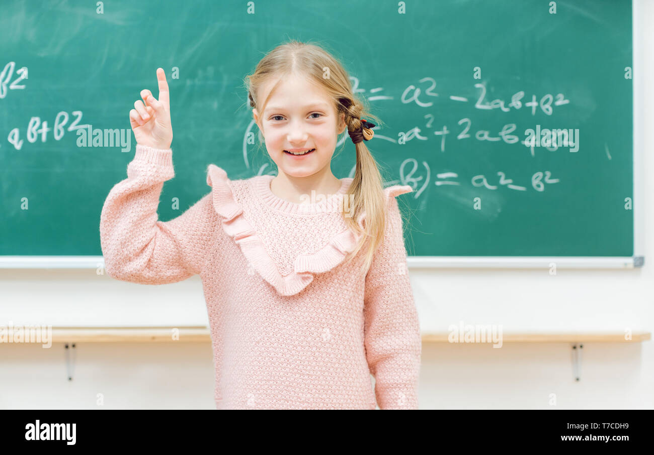 Genius schoolgirl could solve the math task Stock Photo - Alamy