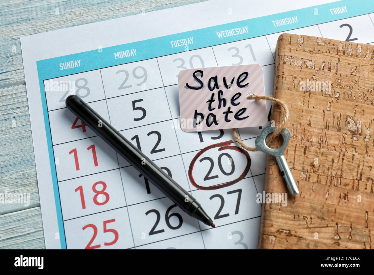 Key with "Save the date" tag, notebook and marker on calendar Stock ...