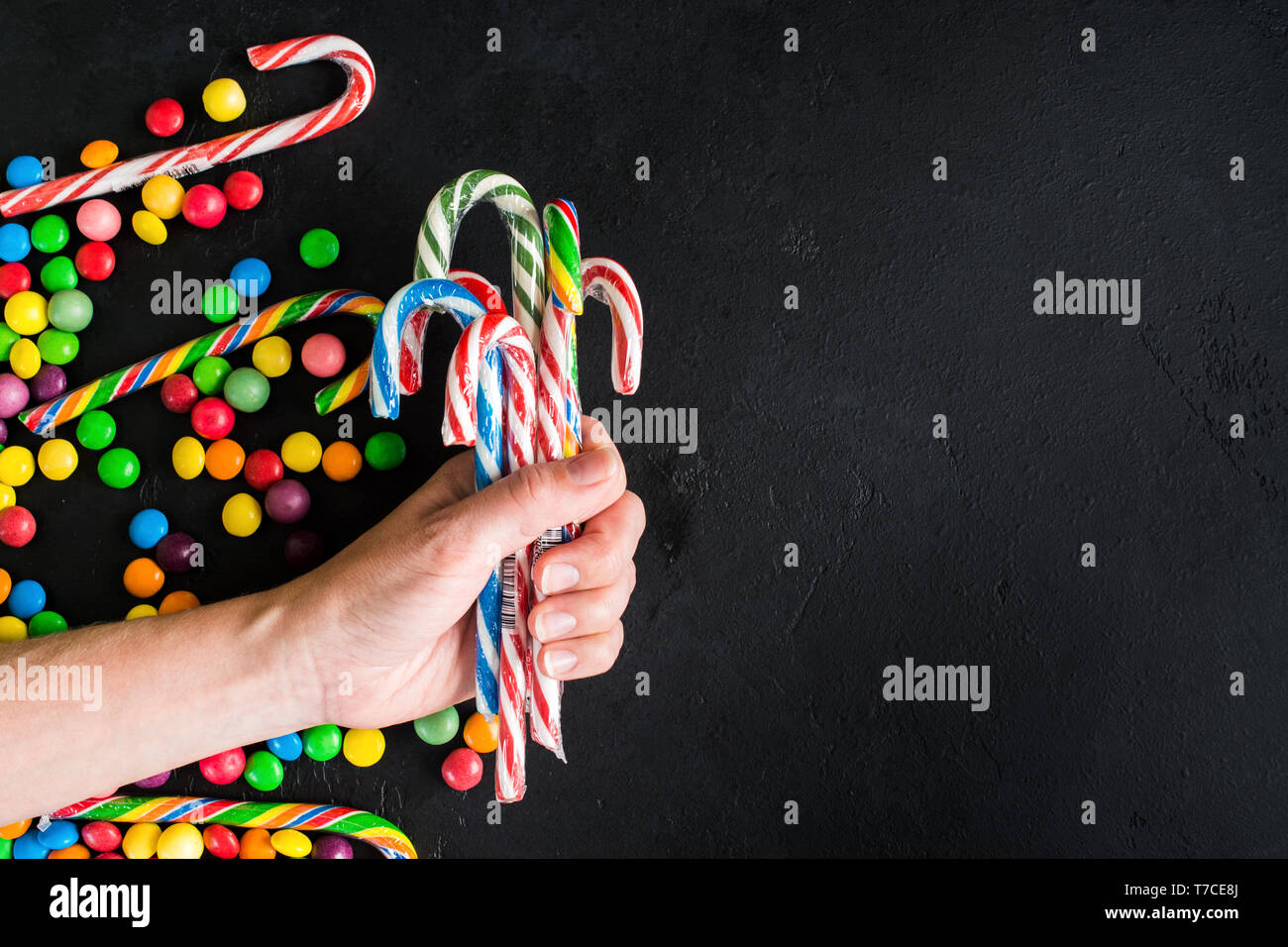 Hand holding candy hi-res stock photography and images - Alamy