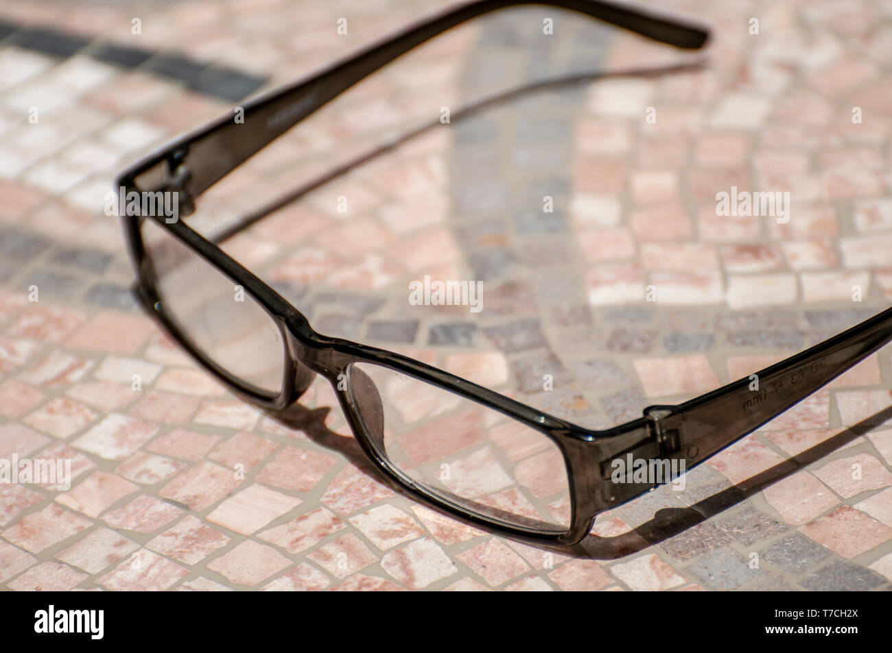Black eyeglasses rest on hi-res stock photography and images - Alamy