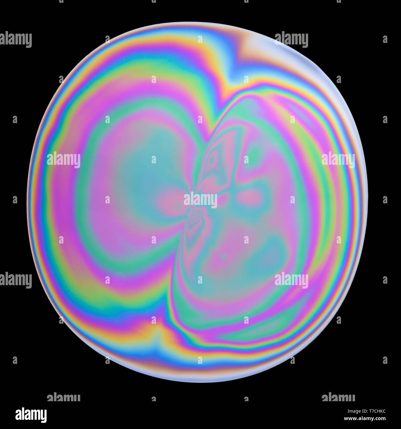 Photo of abstract colorful iridescent oil circle isolated on black ...