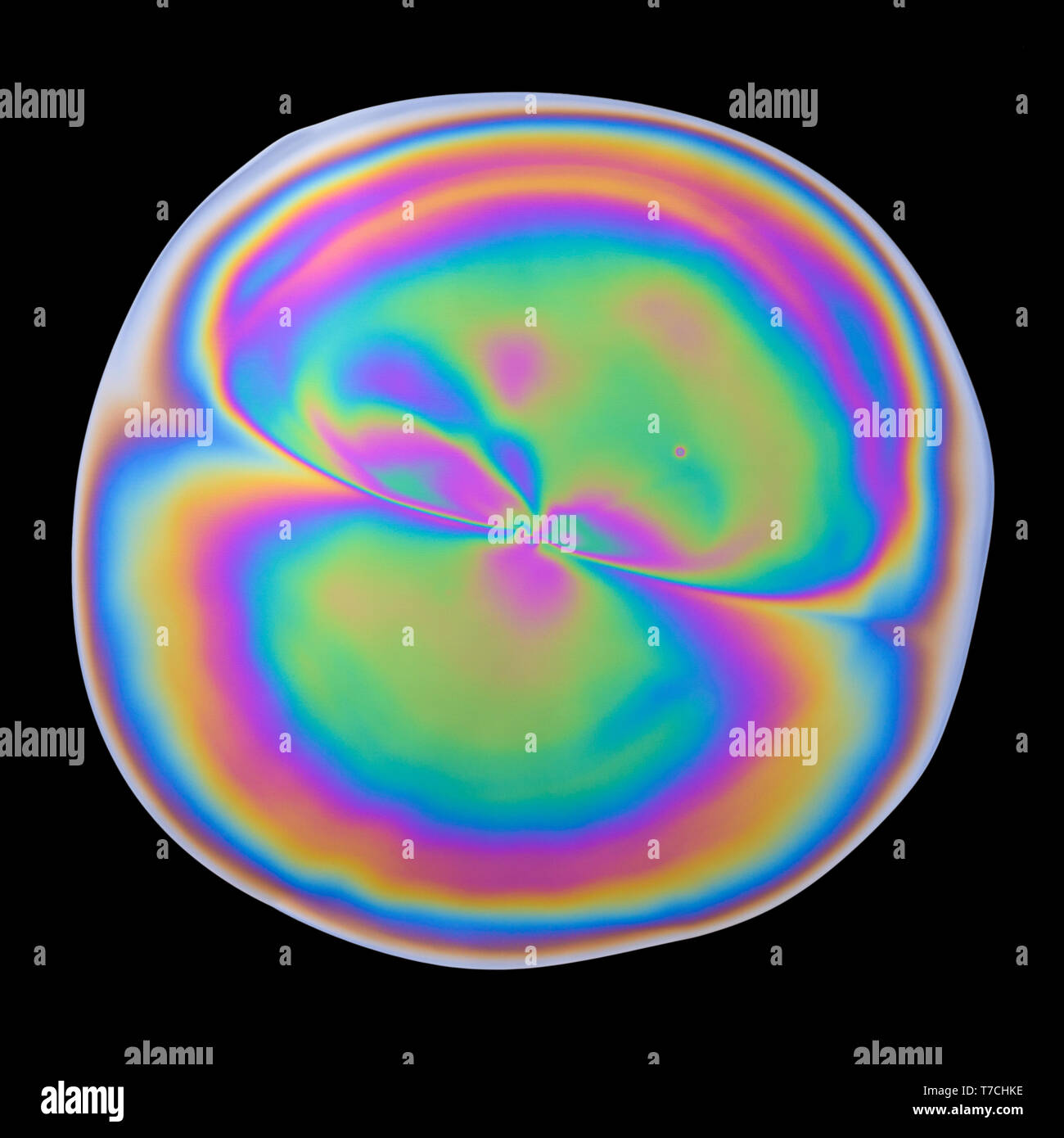 Photo of abstract colorful iridescent oil circle isolated on black ...