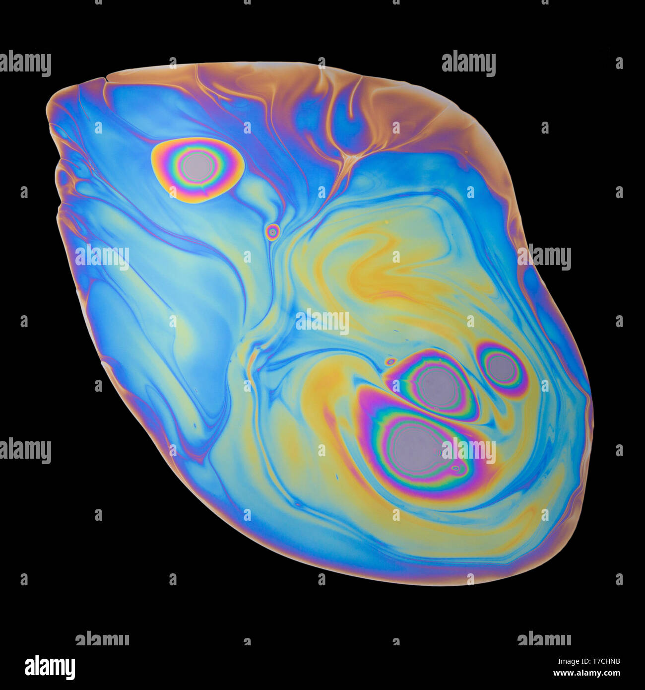 Colorful bright iridescent oil spill isolated on black background Stock ...