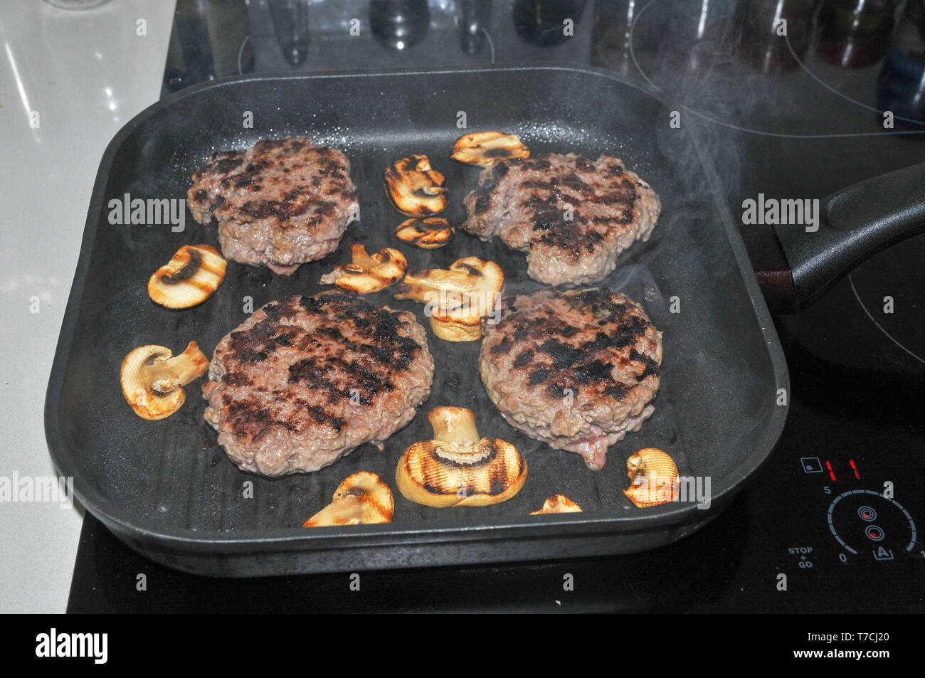 Home cooked hamburger on a skillet Stock Photo - Alamy