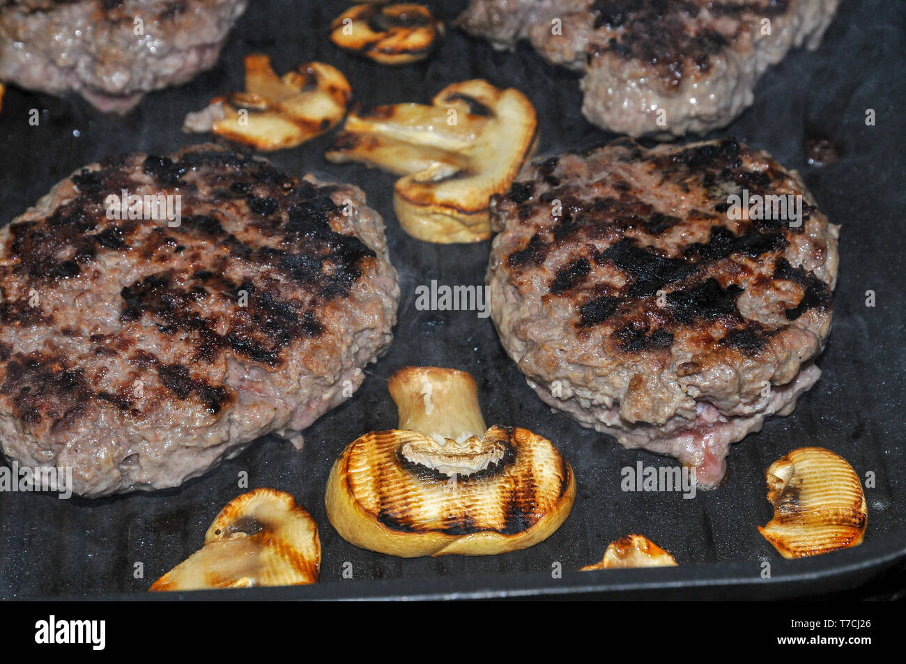 Home cooked hamburger on a skillet Stock Photo - Alamy