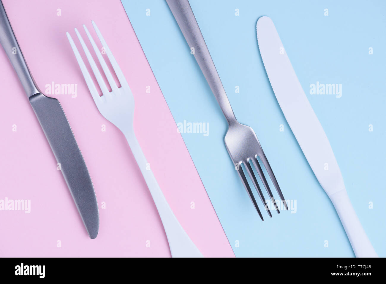 Knife and fork set on trendy soft pastel color paper background Stock ...
