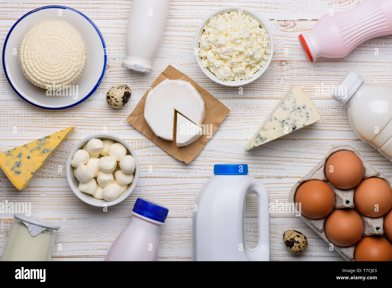 Different dairy products on white wooden table flat lay top view Stock ...