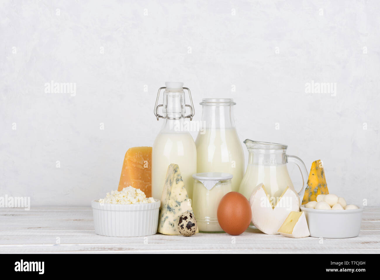 Dairy products on white wooden table with side copy space Stock Photo ...
