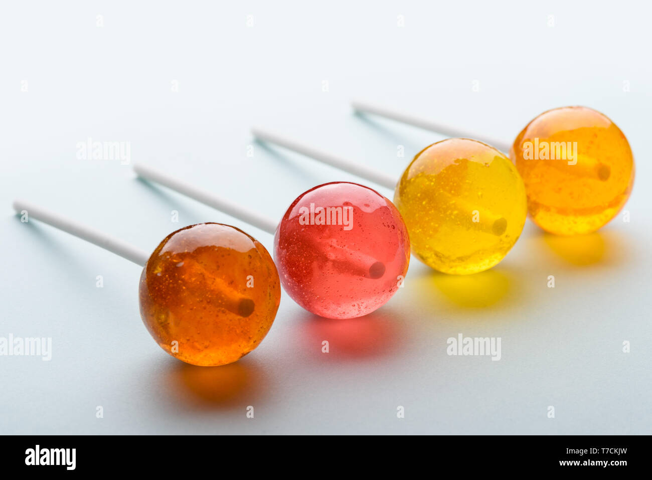 Lollipops assortment on pastel background Stock Photo - Alamy