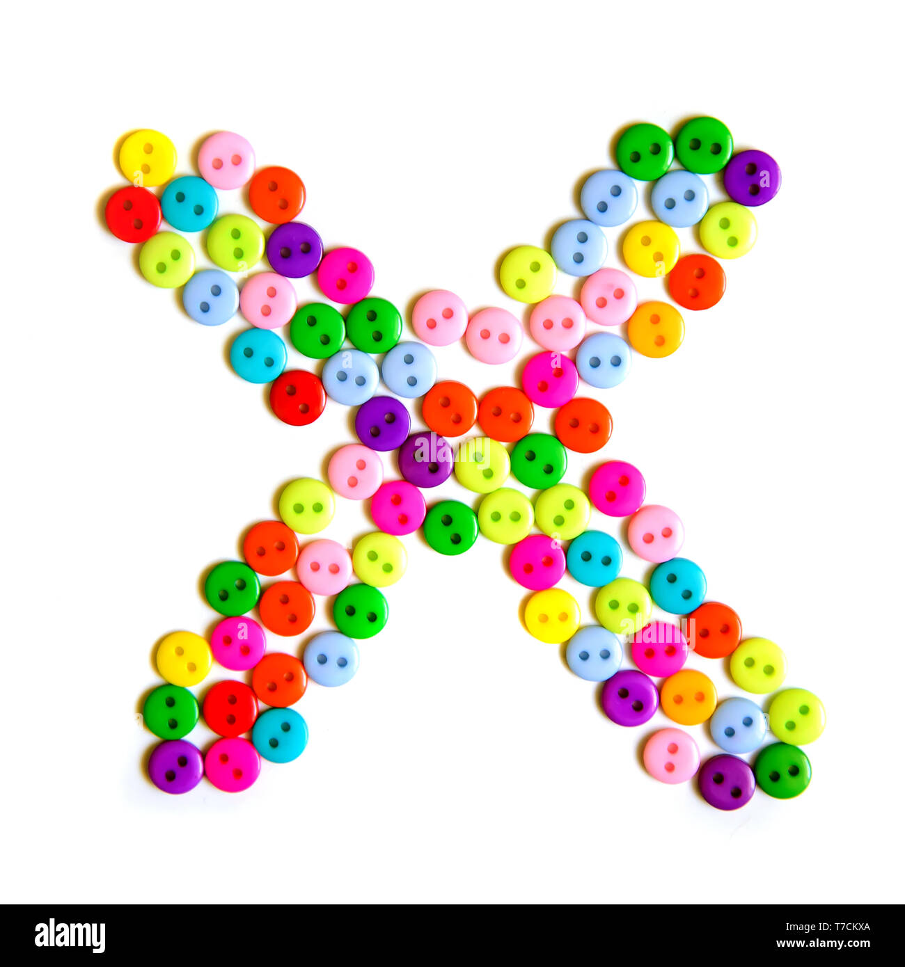 Letter X of the English alphabet from a group of colorful small buttons ...
