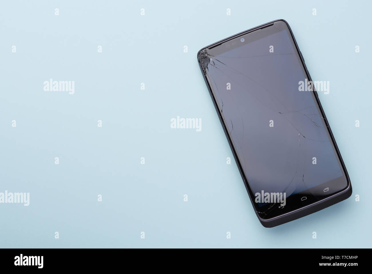 Smartphone with broken glass screen phone touch screen on blue ...