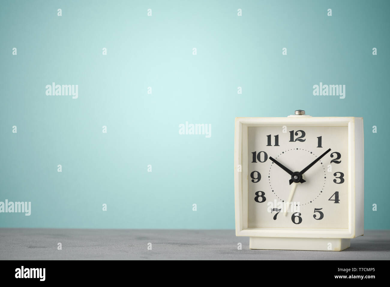 Retro old classic alarm clock blue vintage color background with copy ...