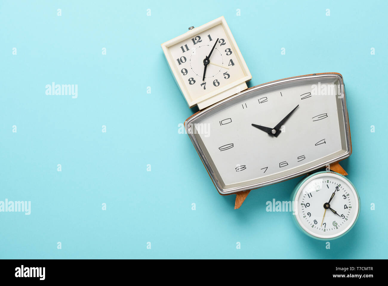 Retro alarm clocks on blue pastel background time concept flat lay top ...